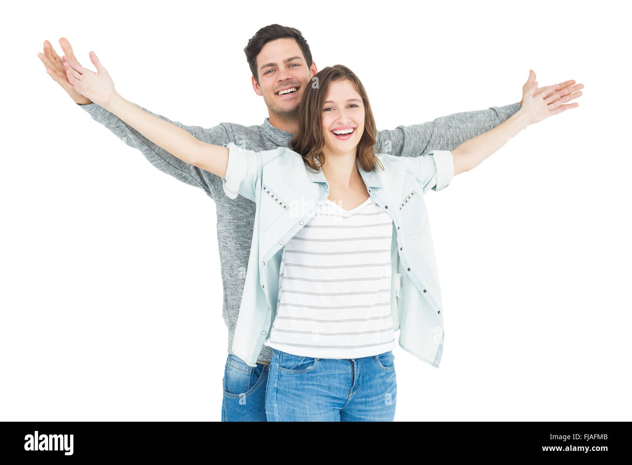 Couple embracing with arms out Stock Photo - Alamy