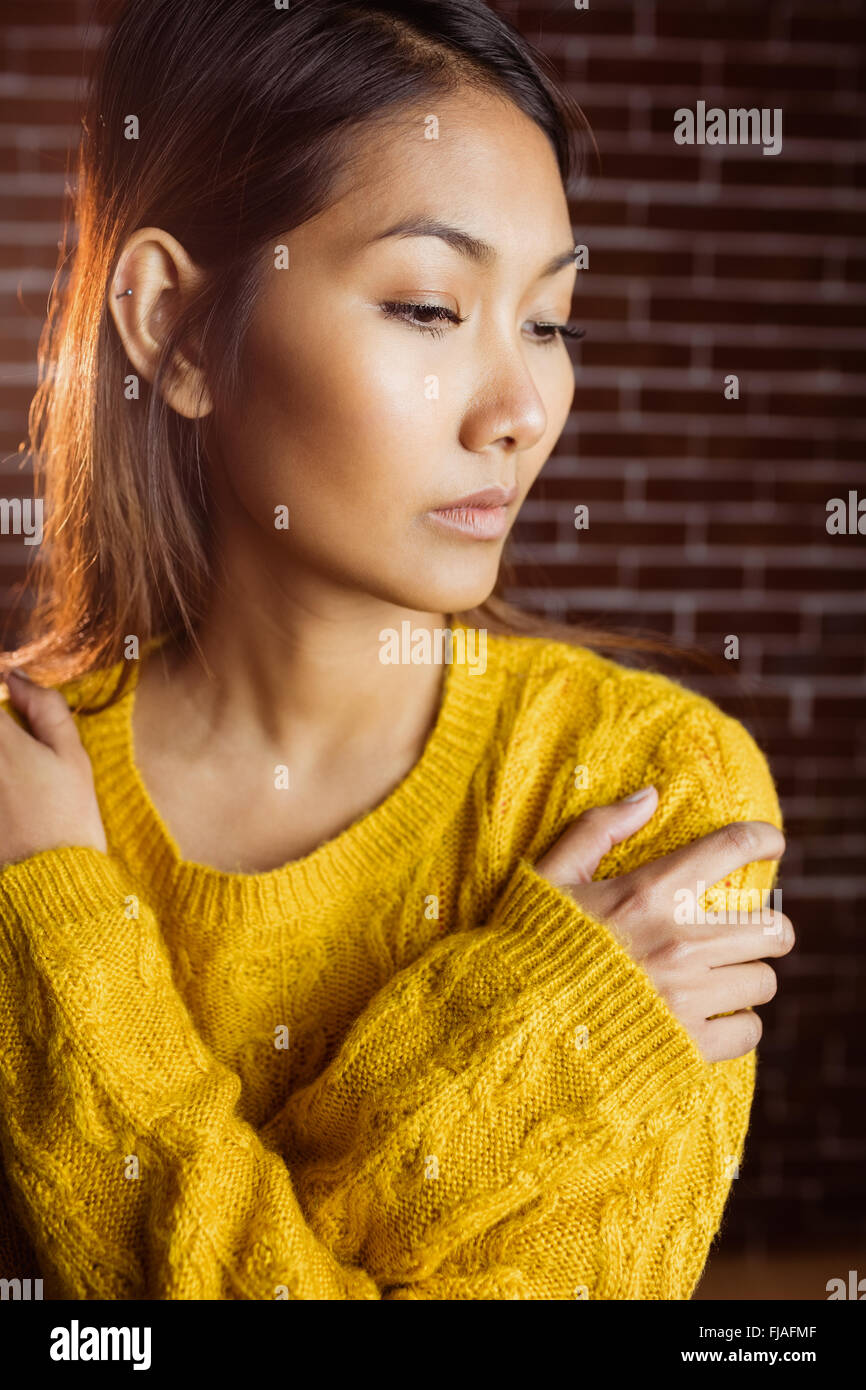 Serious asian woman looking down Stock Photo - Alamy