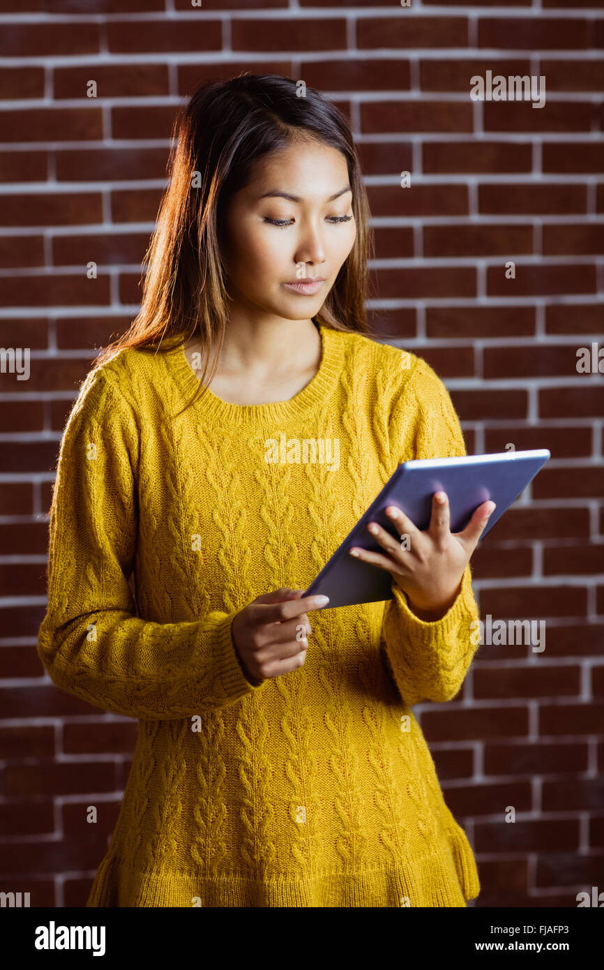 Focused asian woman using tablet Stock Photo - Alamy