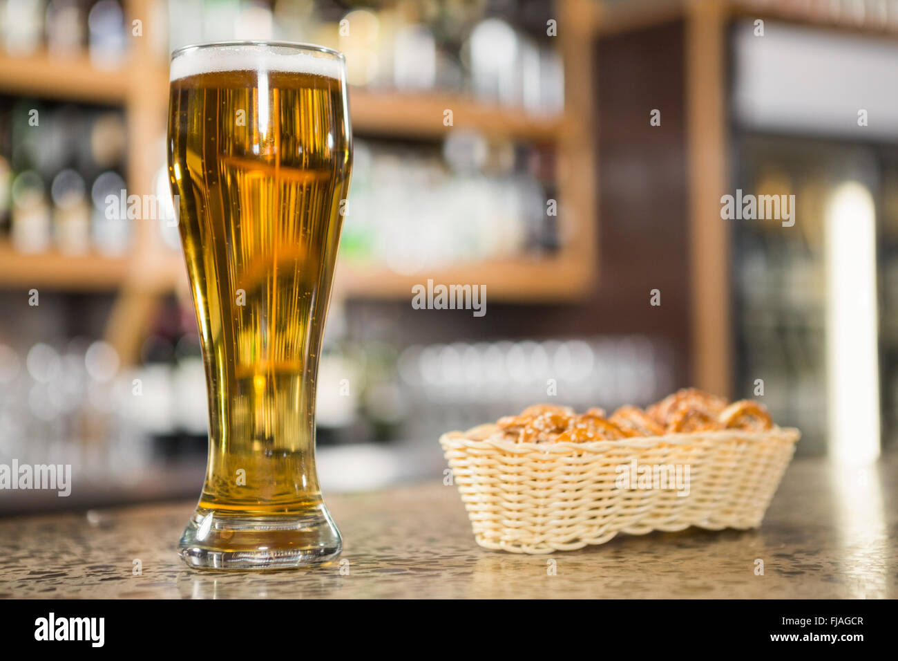 View of a pint of beer and pretzels Stock Photo - Alamy