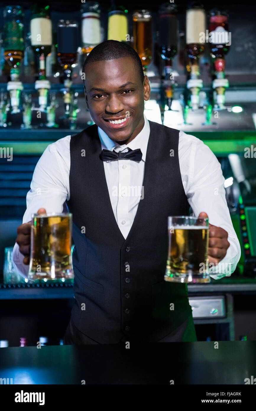 Bartender serving two hi-res stock photography and images - Alamy