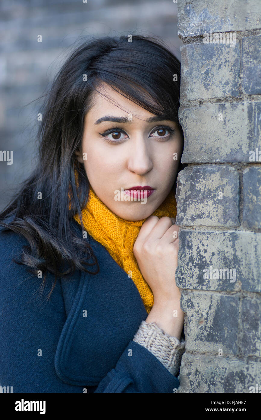 Woman hiding behind wall a watching hi-res stock photography and images ...