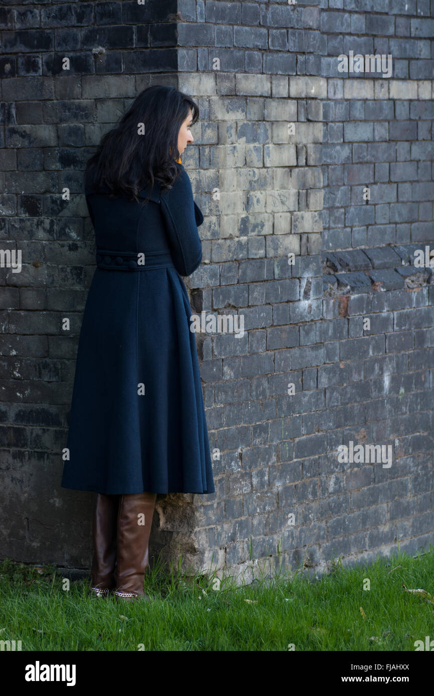 Hiding behind back woman hi-res stock photography and images - Alamy