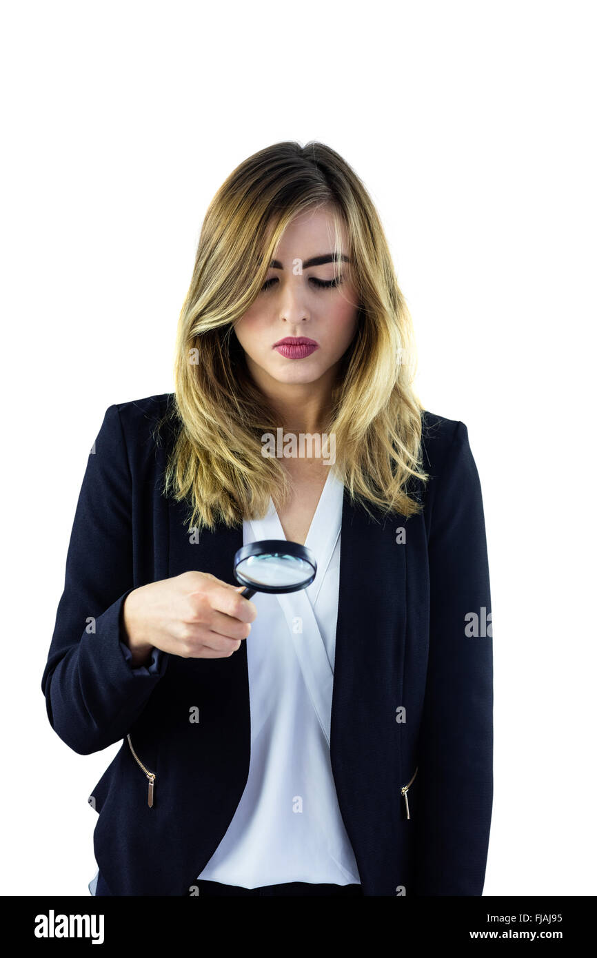 Woman using magnifying glass Stock Photo - Alamy