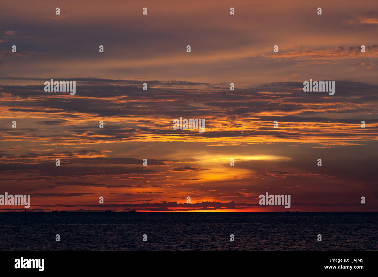 Beautiful red sunset over the ocean Stock Photo - Alamy