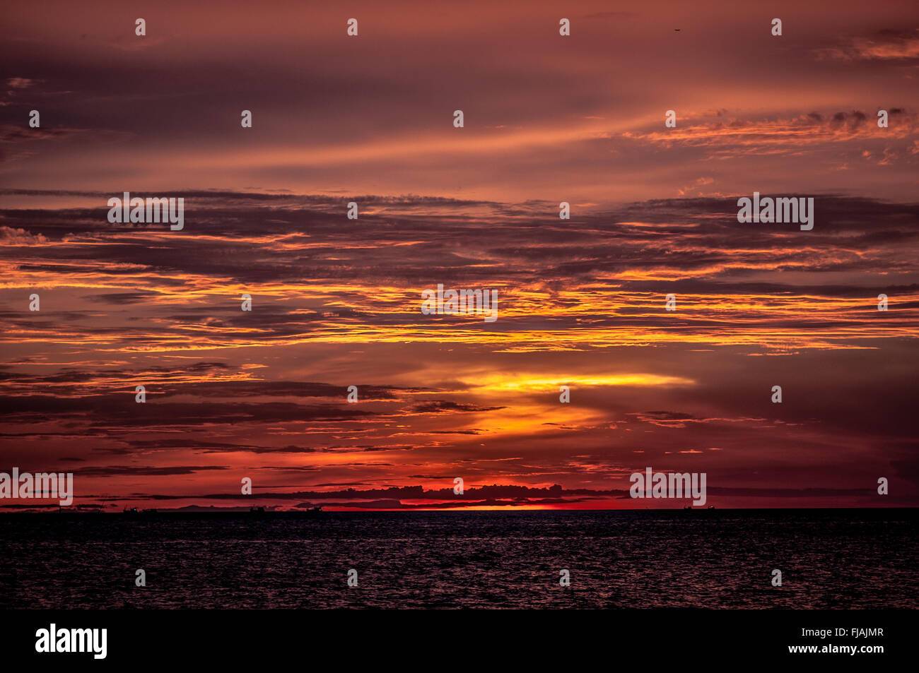 Beautiful red sunset over the ocean Stock Photo - Alamy