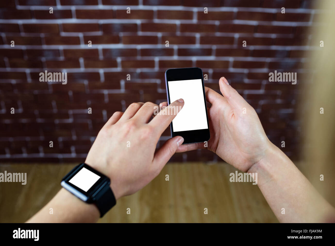 Feminine hands using smartphone and smart watch Stock Photo - Alamy