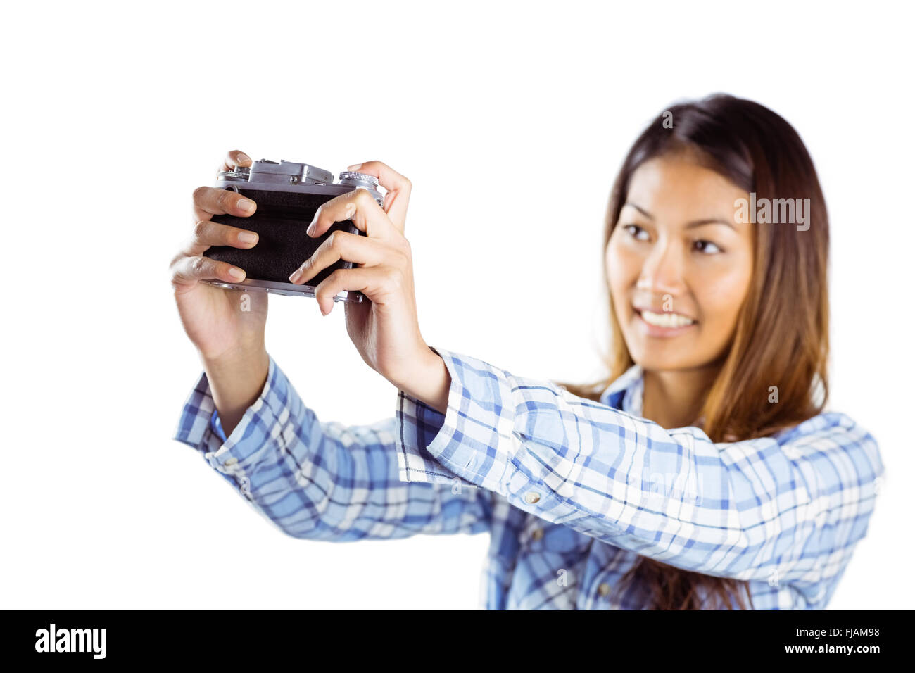 Smiling asian woman taking picture with camera Stock Photo - Alamy