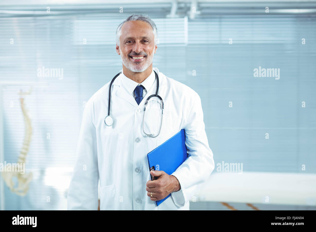 Doctor standing in clinic Stock Photo - Alamy