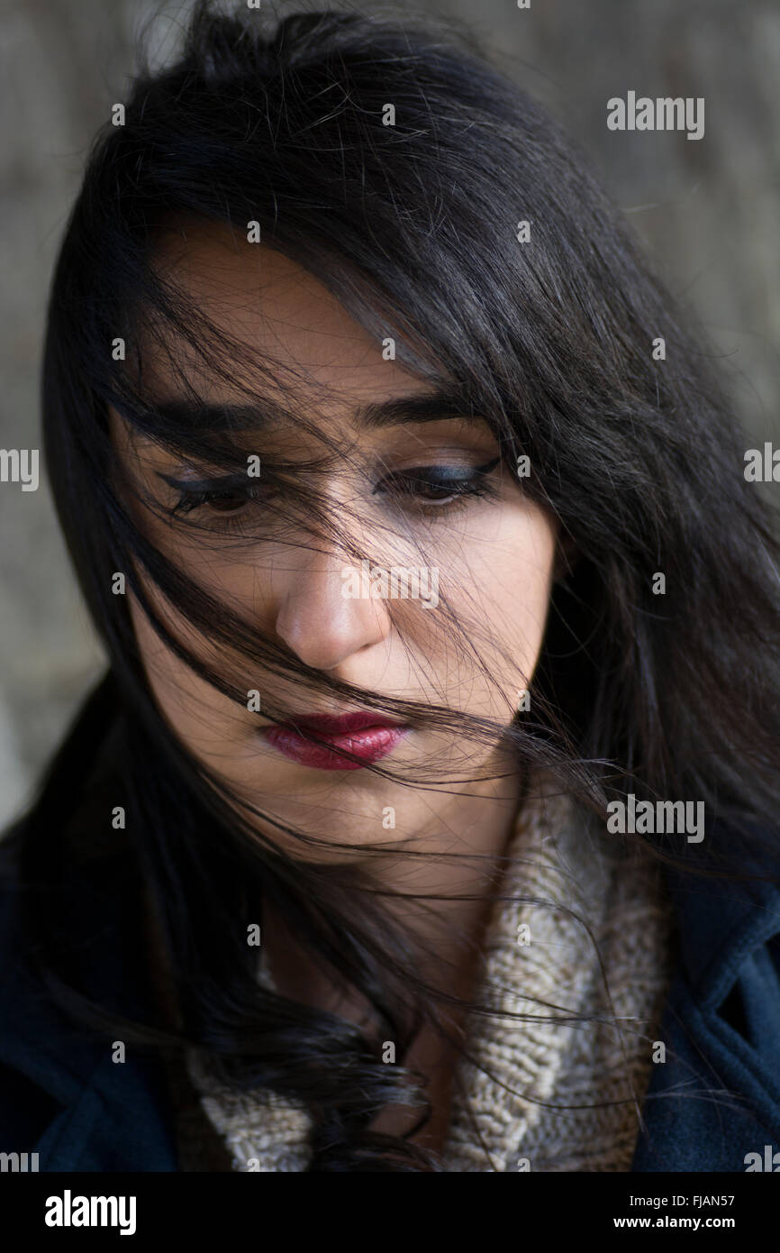 Sad young woman hair covering face Stock Photo - Alamy