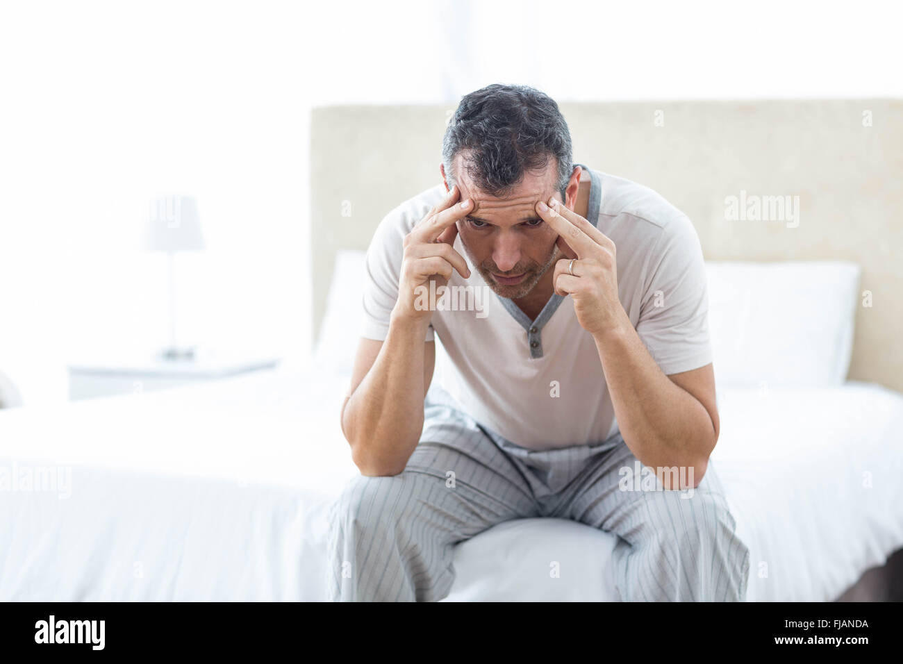 Mature Worried Man Bed High Resolution Stock Photography and Images - Alamy