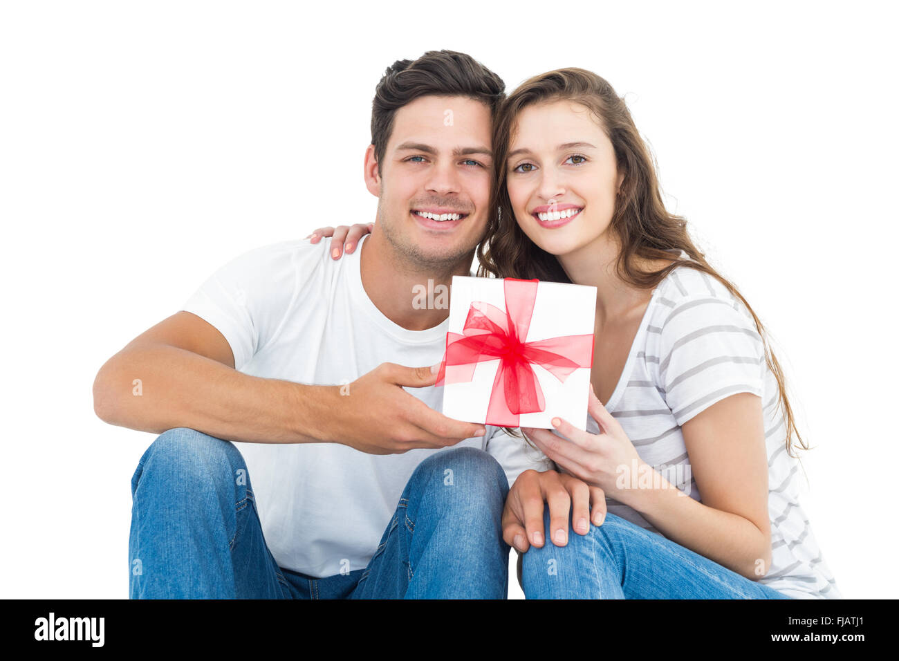 Happy couple receiving a gift Stock Photo - Alamy