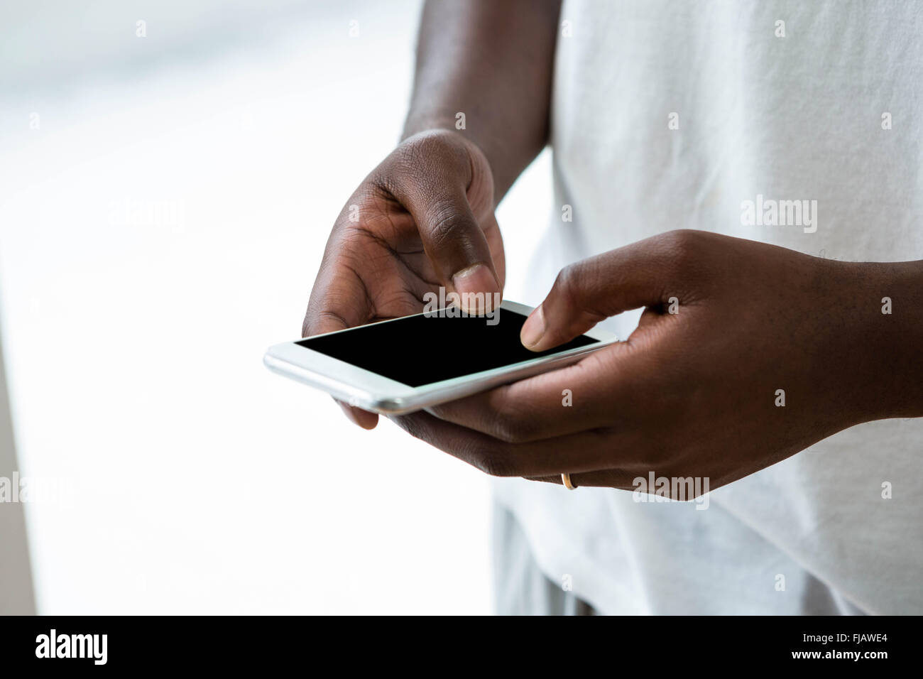 Man text messaging on mobile phone Stock Photo - Alamy