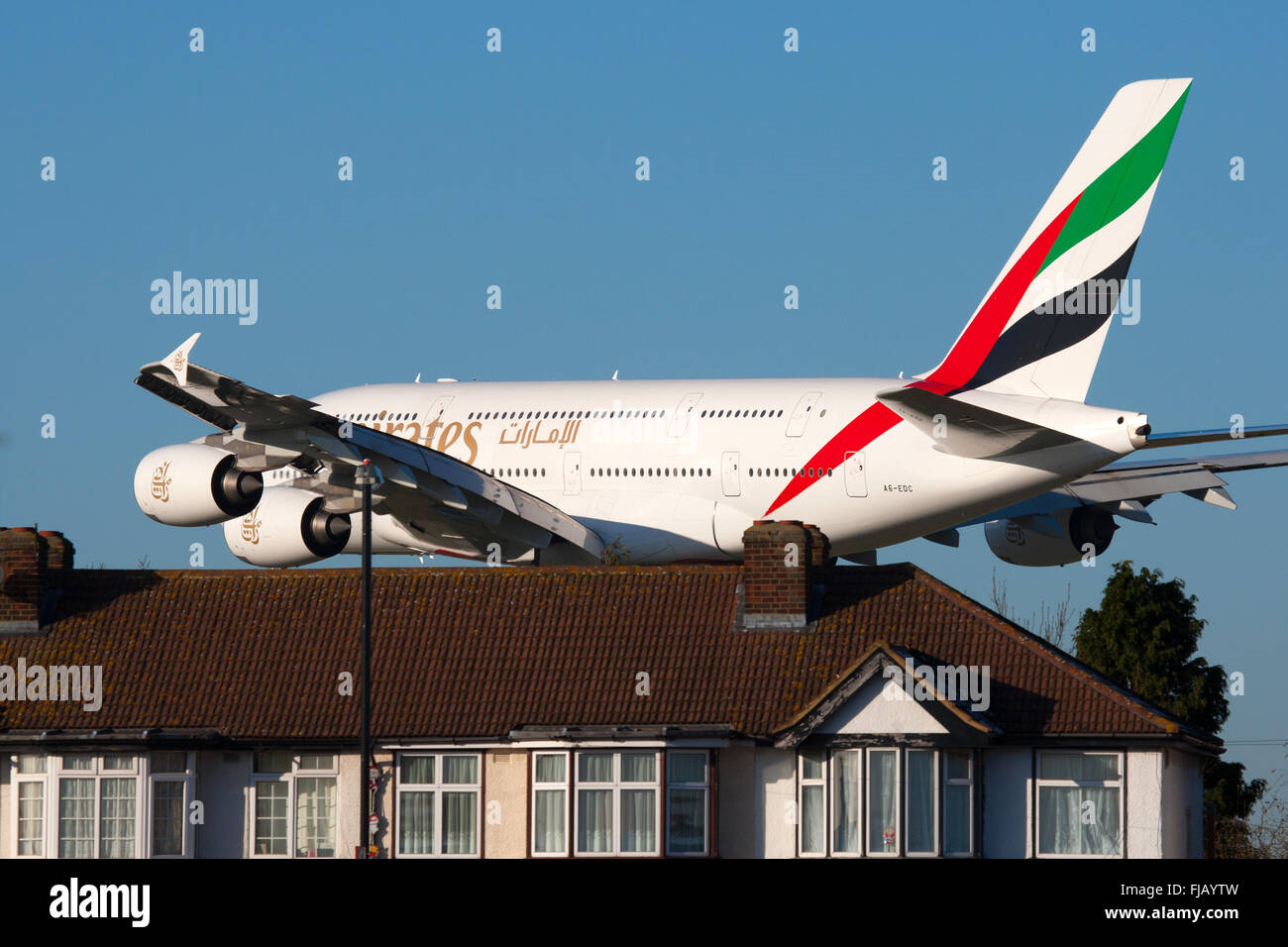 Emirates Airbus A380 low over Houses at London Heathrow Stock Photo - Alamy