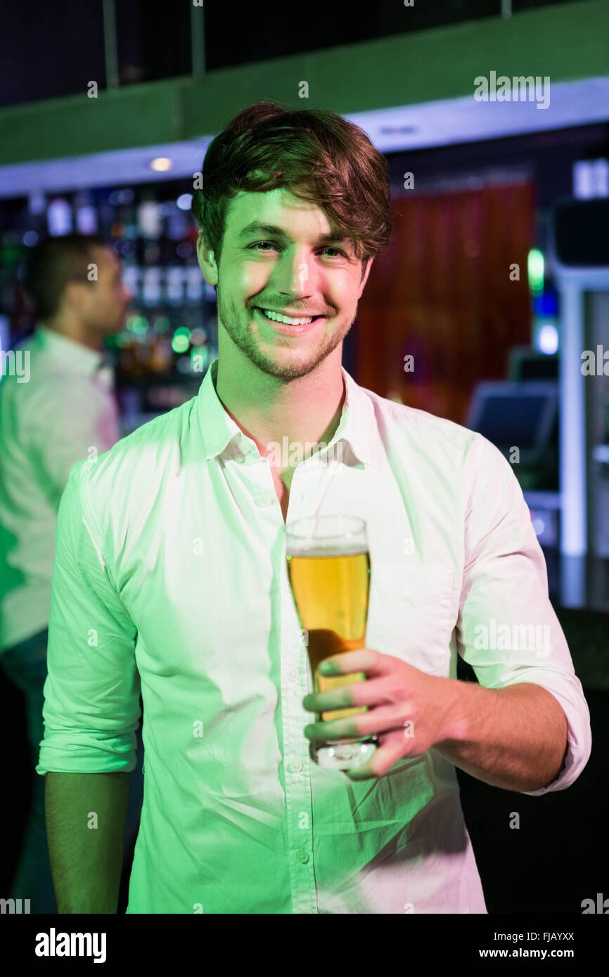 Man posing with glass of beer Stock Photo - Alamy