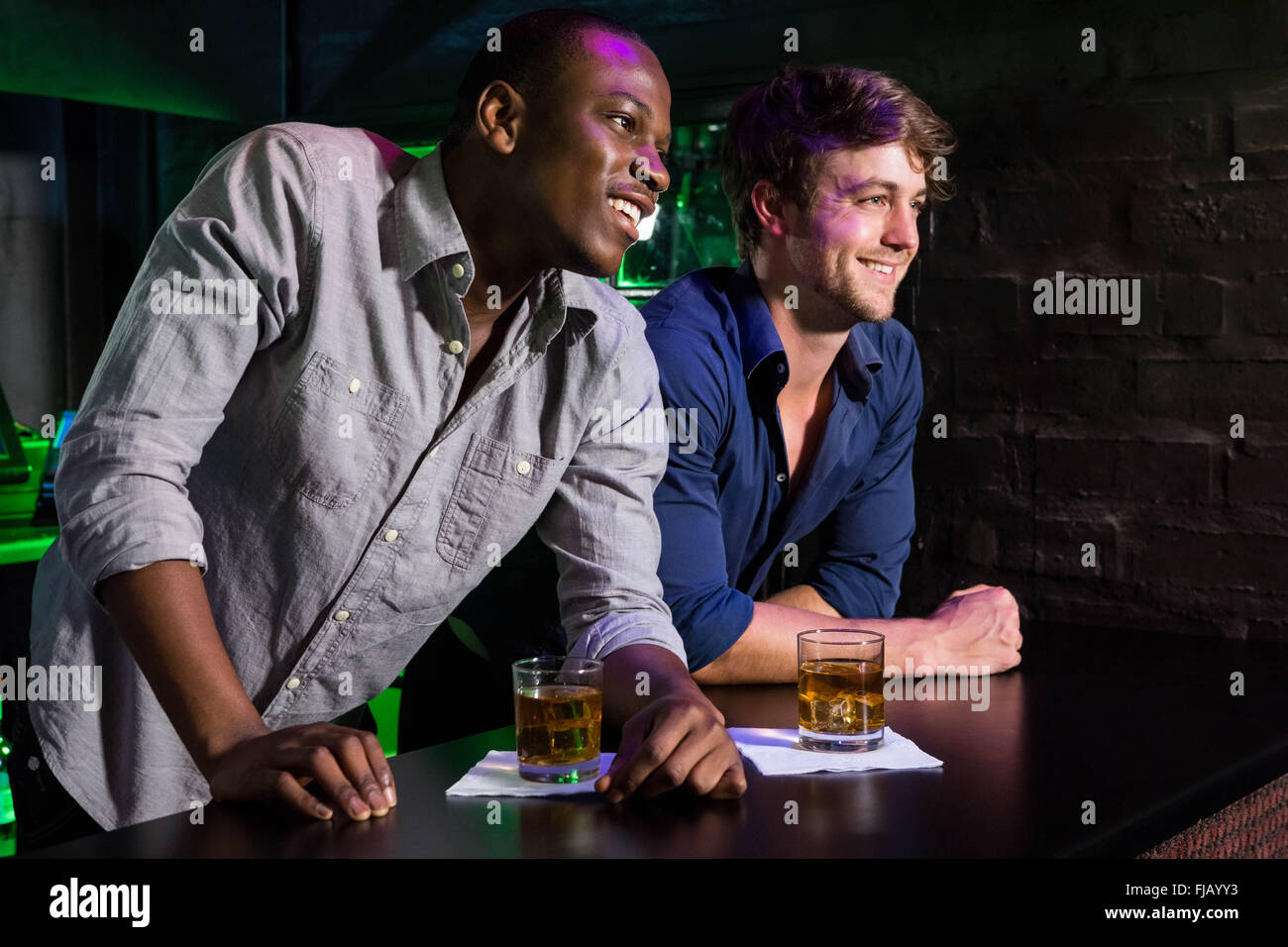 Young men at bar counter hi-res stock photography and images - Alamy
