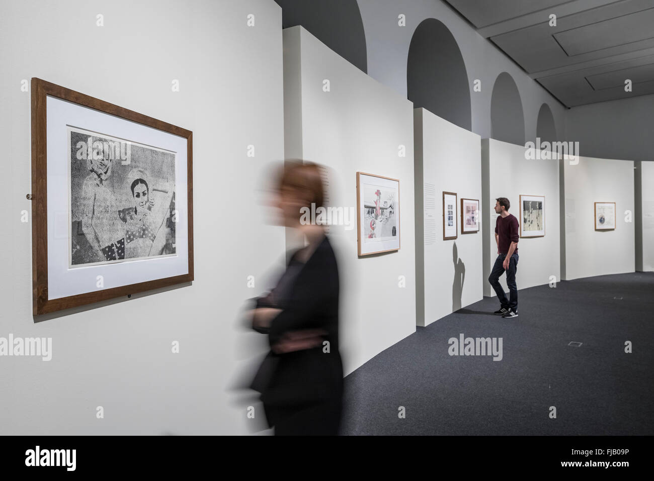 HANDOUT - A handout shows visitors looking at pictures by painter ...