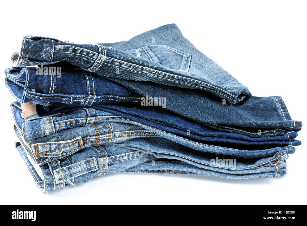 Various models of jeans for men stacked up and photographed in the ...