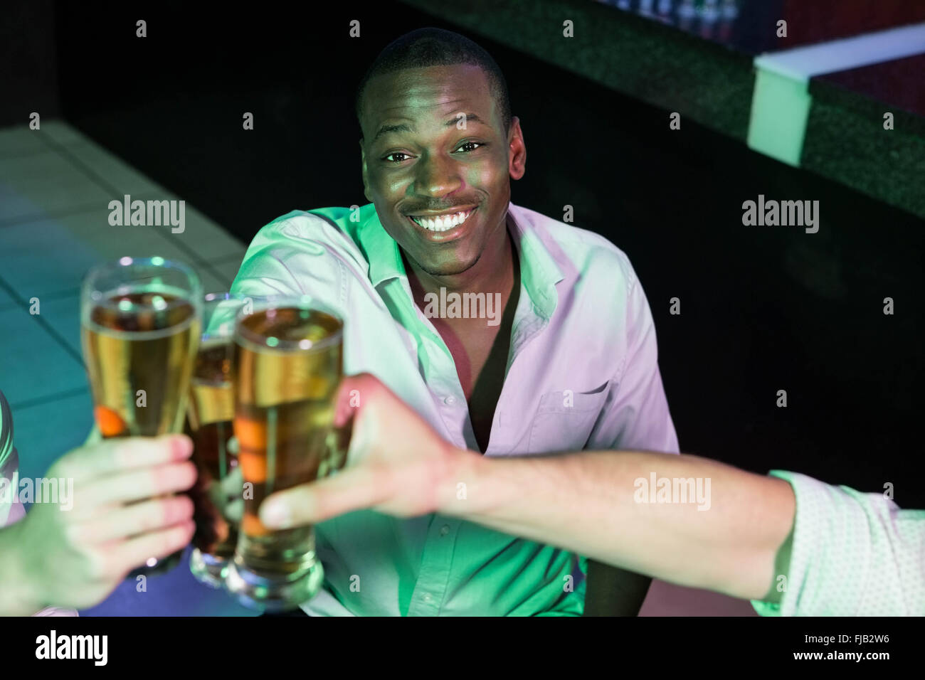 Happy man toasting his glass of beer Stock Photo - Alamy