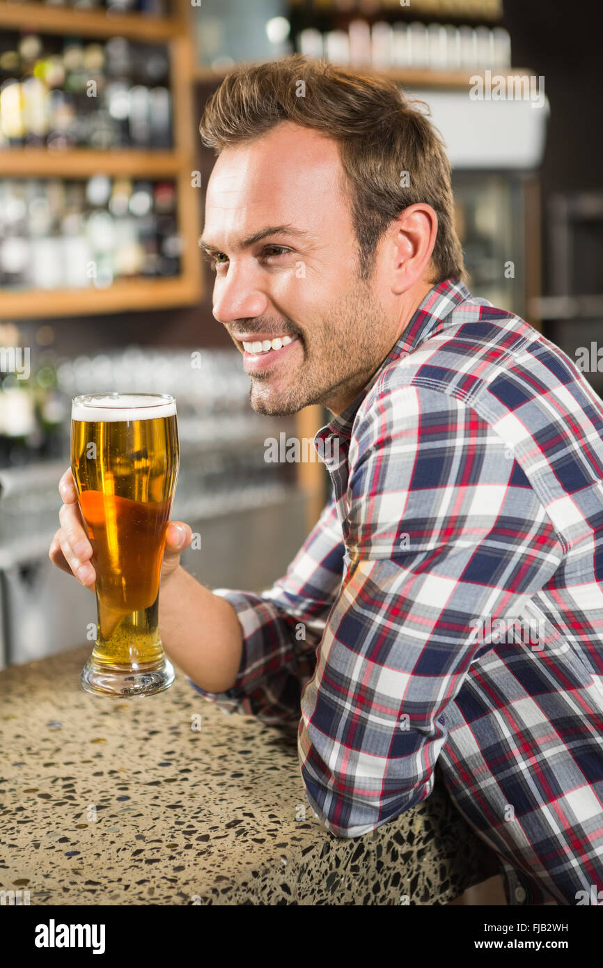 Handsome man having a beer Stock Photo - Alamy