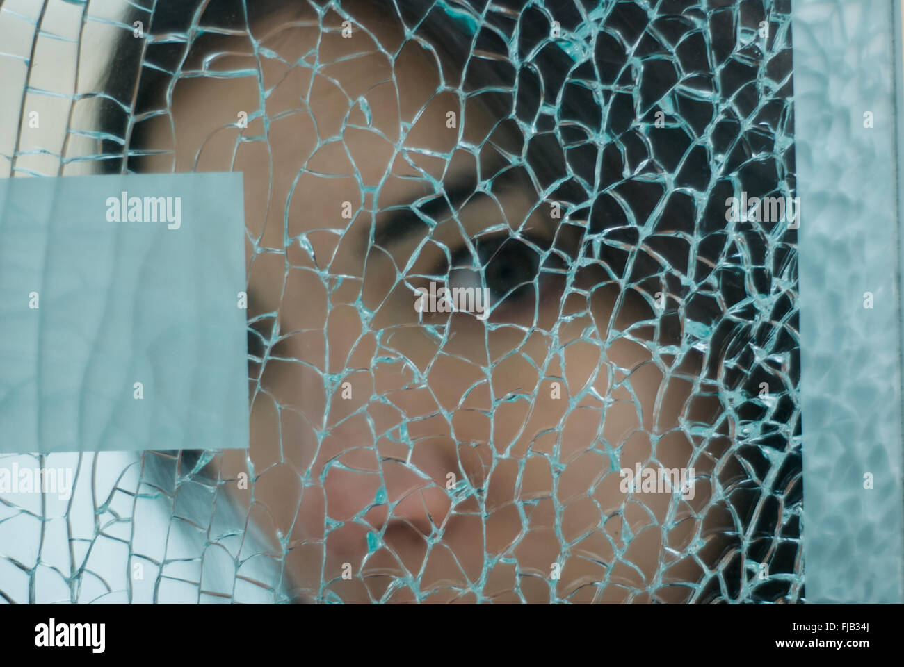 Portrait through shattered safety glass Stock Photo - Alamy