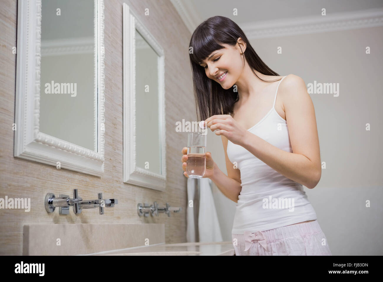 Putting into glass hi-res stock photography and images - Alamy