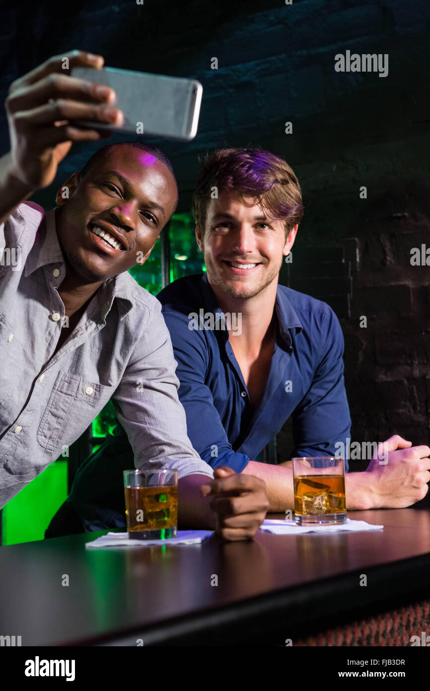 Two men at a bar hi-res stock photography and images - Alamy