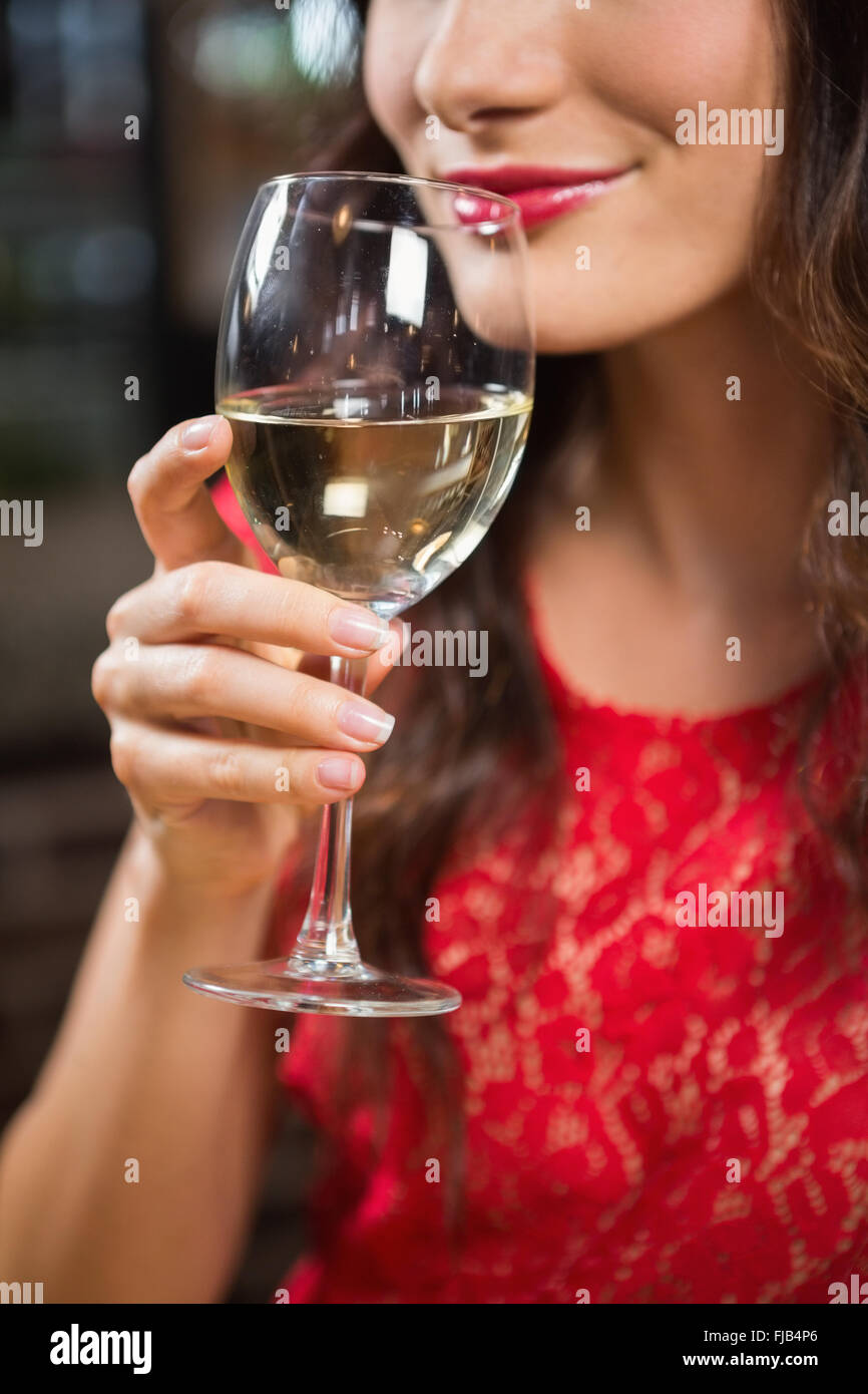 Pretty woman having a glass of wine Stock Photo - Alamy