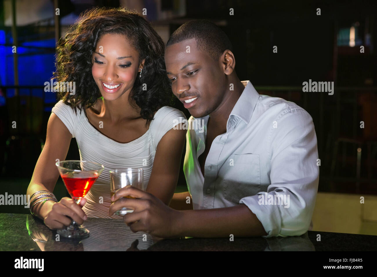 Couple talking drinking bar hi-res stock photography and images - Alamy