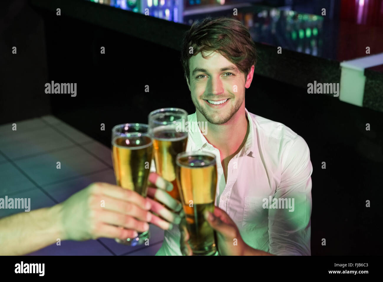 Happy man toasting glass hi-res stock photography and images - Alamy