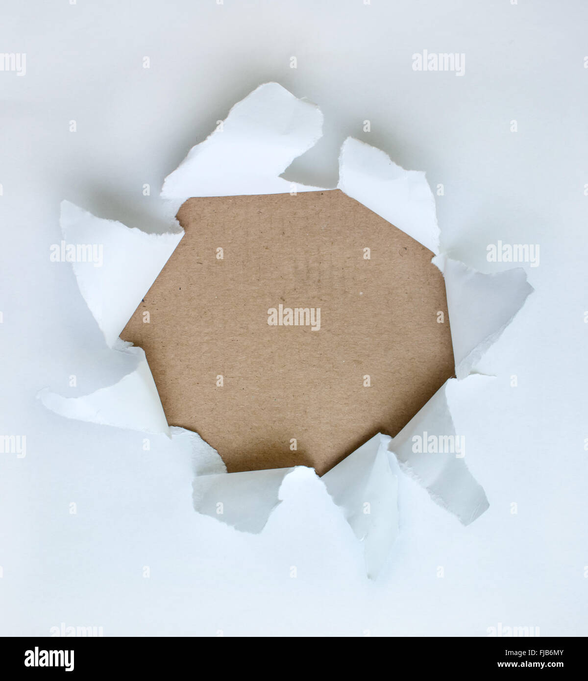 Beige circle shape breakthrough paper hole with white background Stock ...