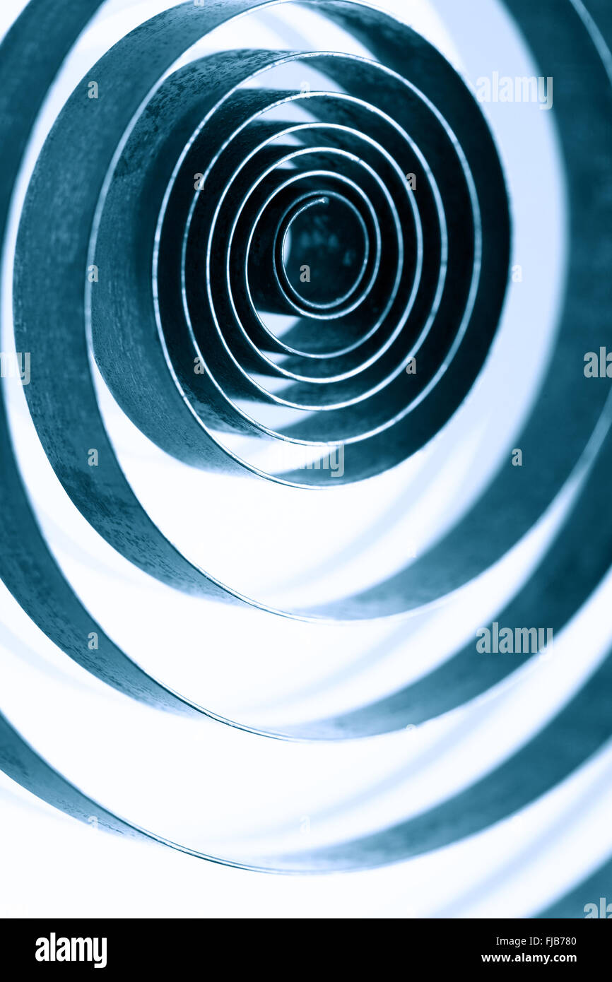 Industrial background. Closeup of old metal spiral on white background ...