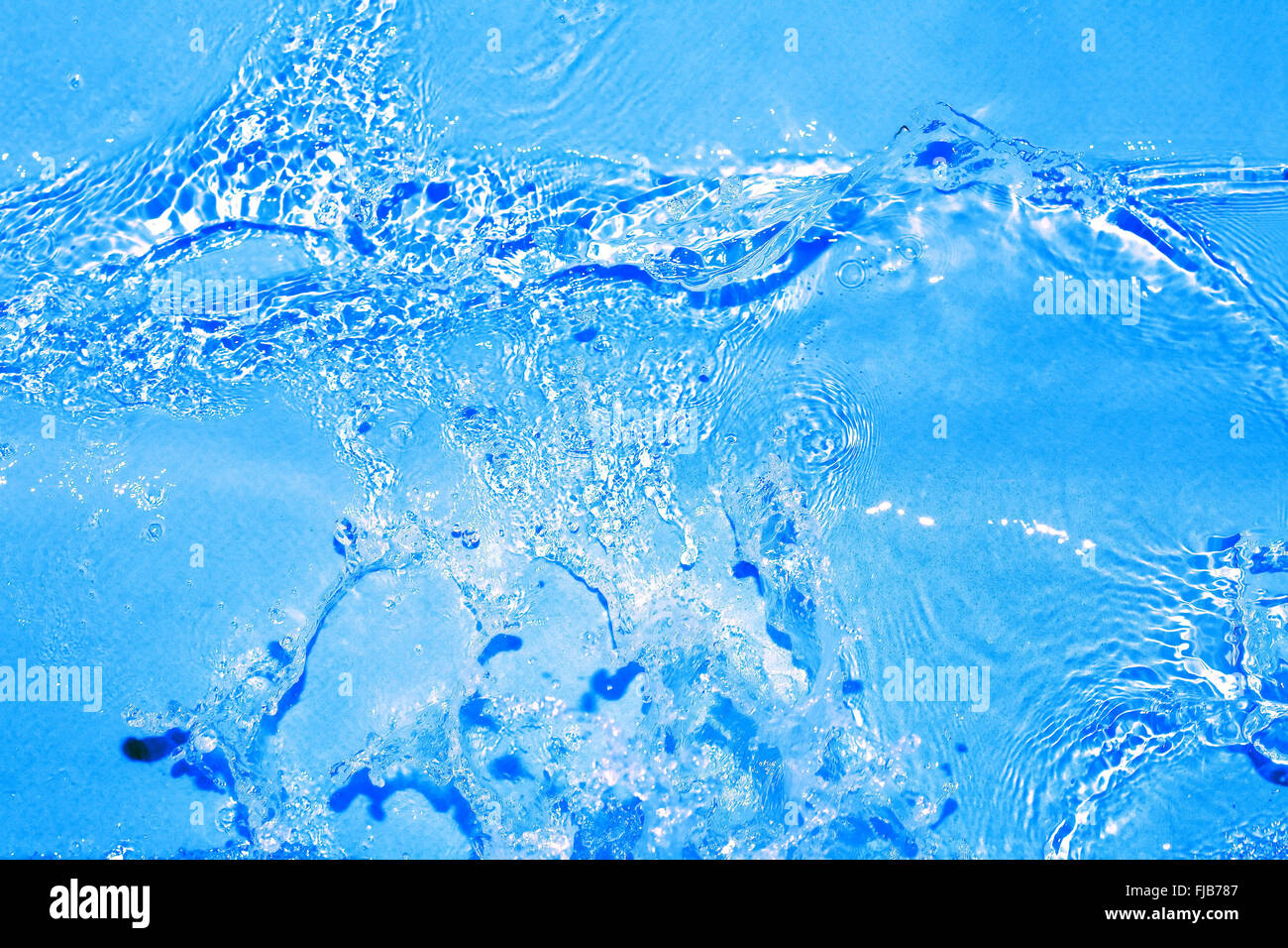 Nice blue background with long water splash Stock Photo - Alamy