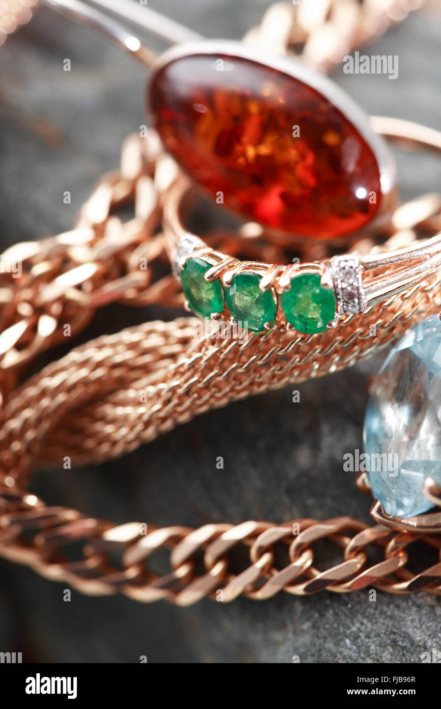 Set of various jewelry adornments on gray stone background Stock Photo ...