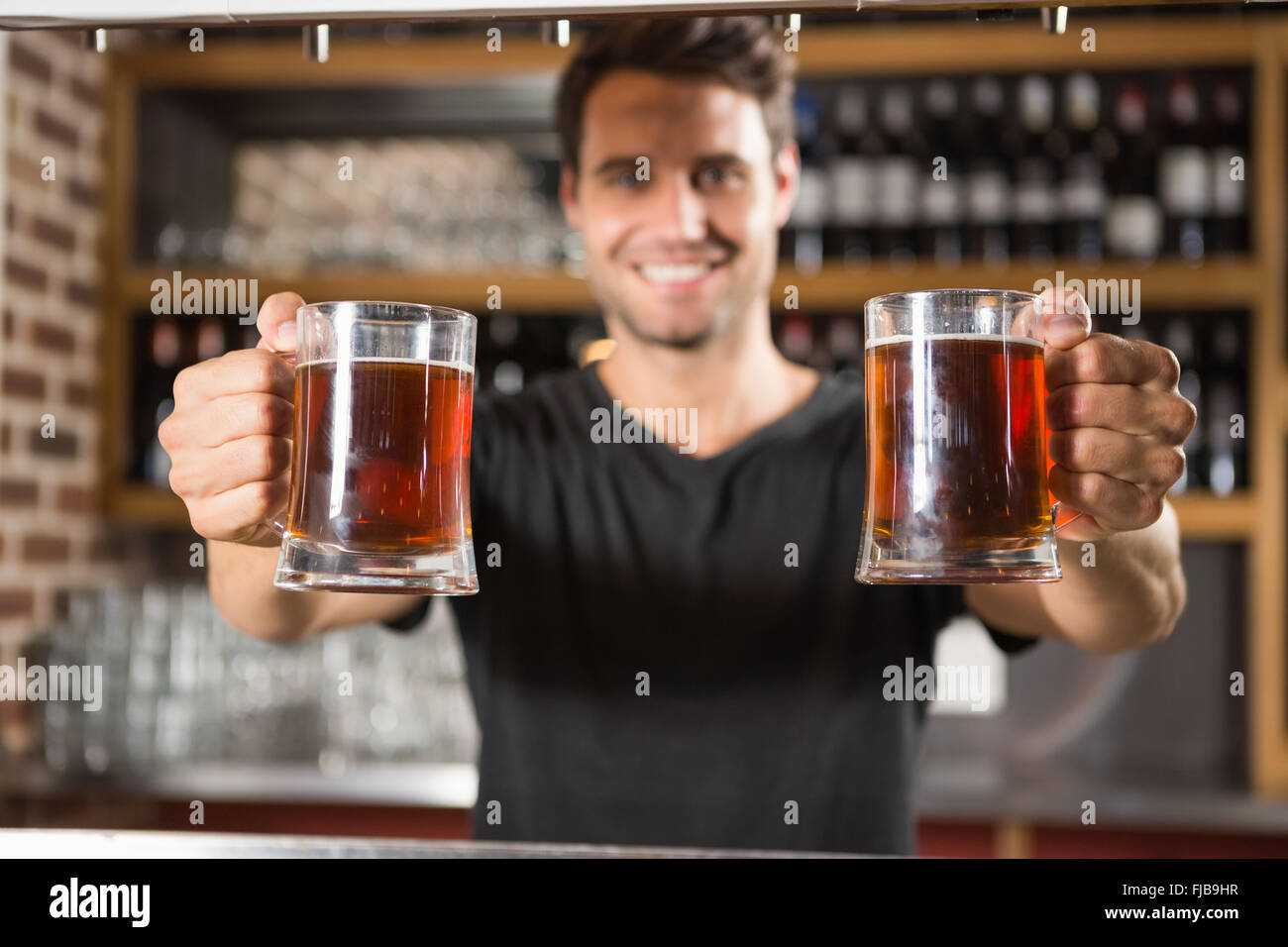 Holding a pint hi-res stock photography and images - Alamy
