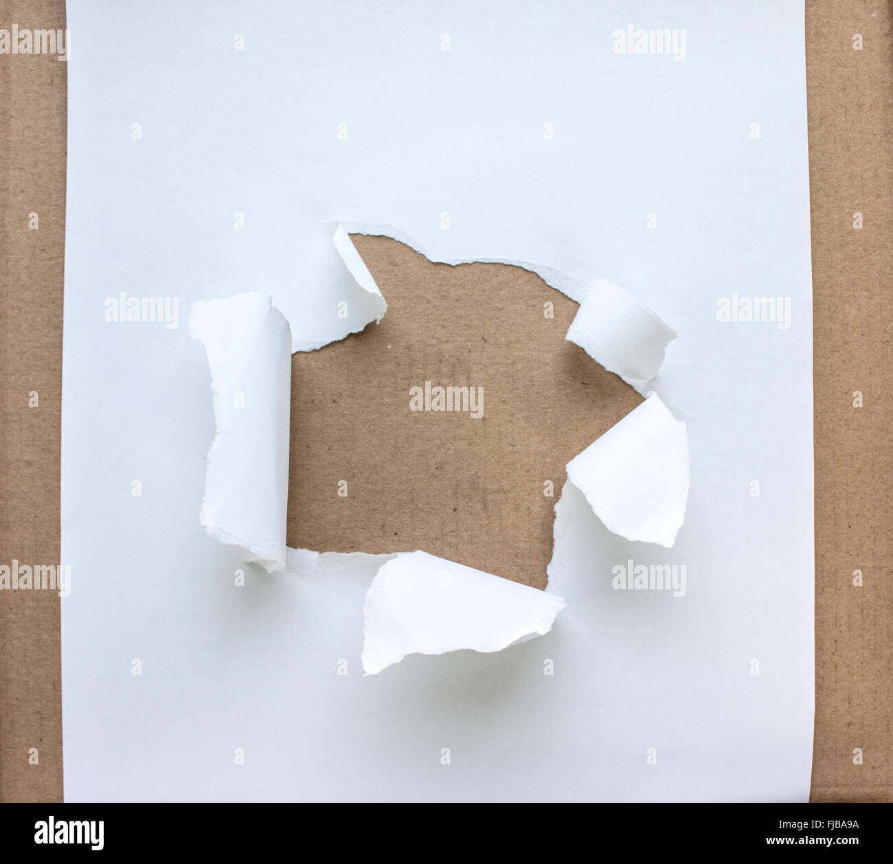 Beige circle shape breakthrough paper hole with white background Stock ...