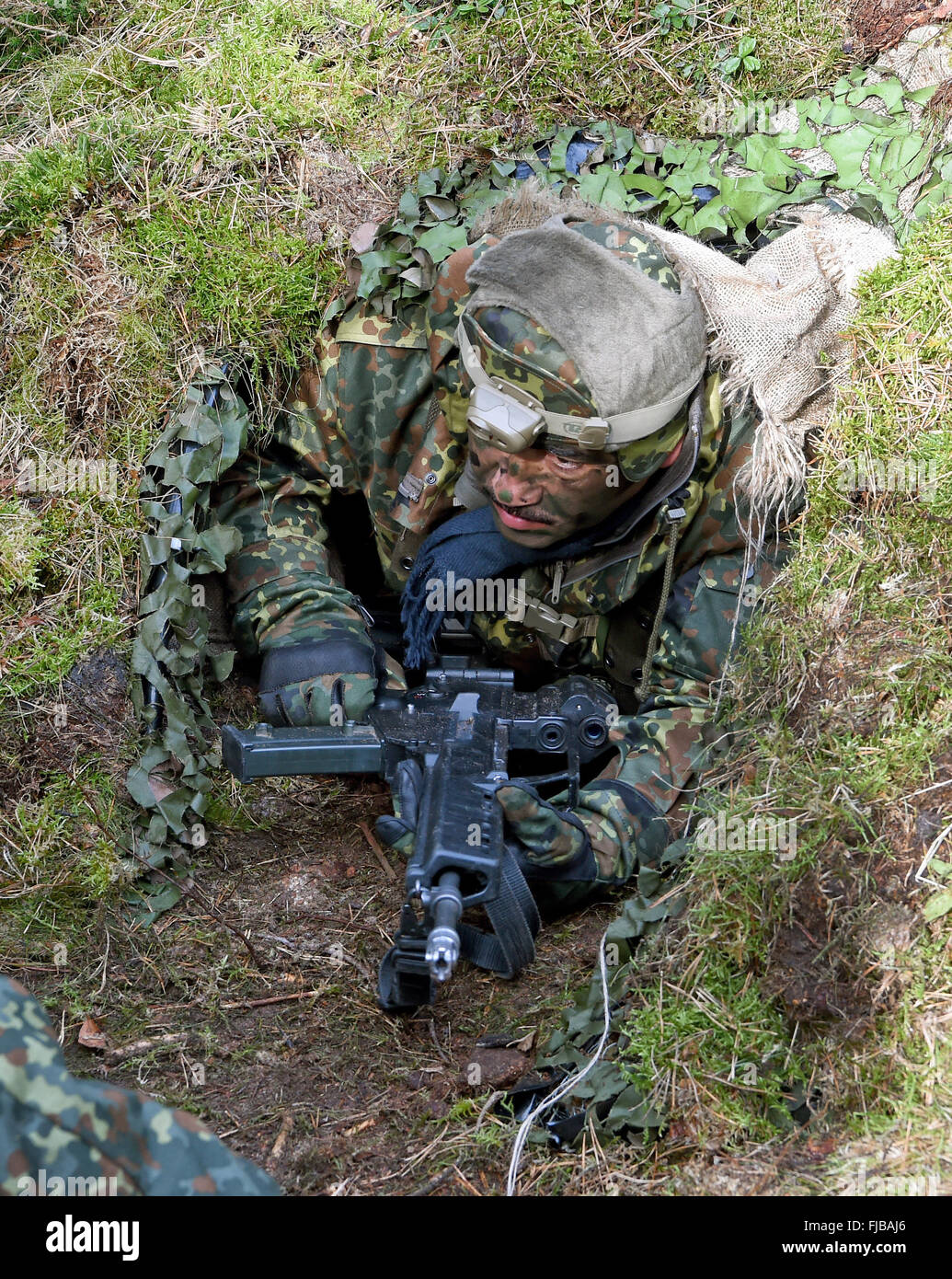 Munster, Germany. 01st Mar, 2016. A Kurdish officer emerging from a ...