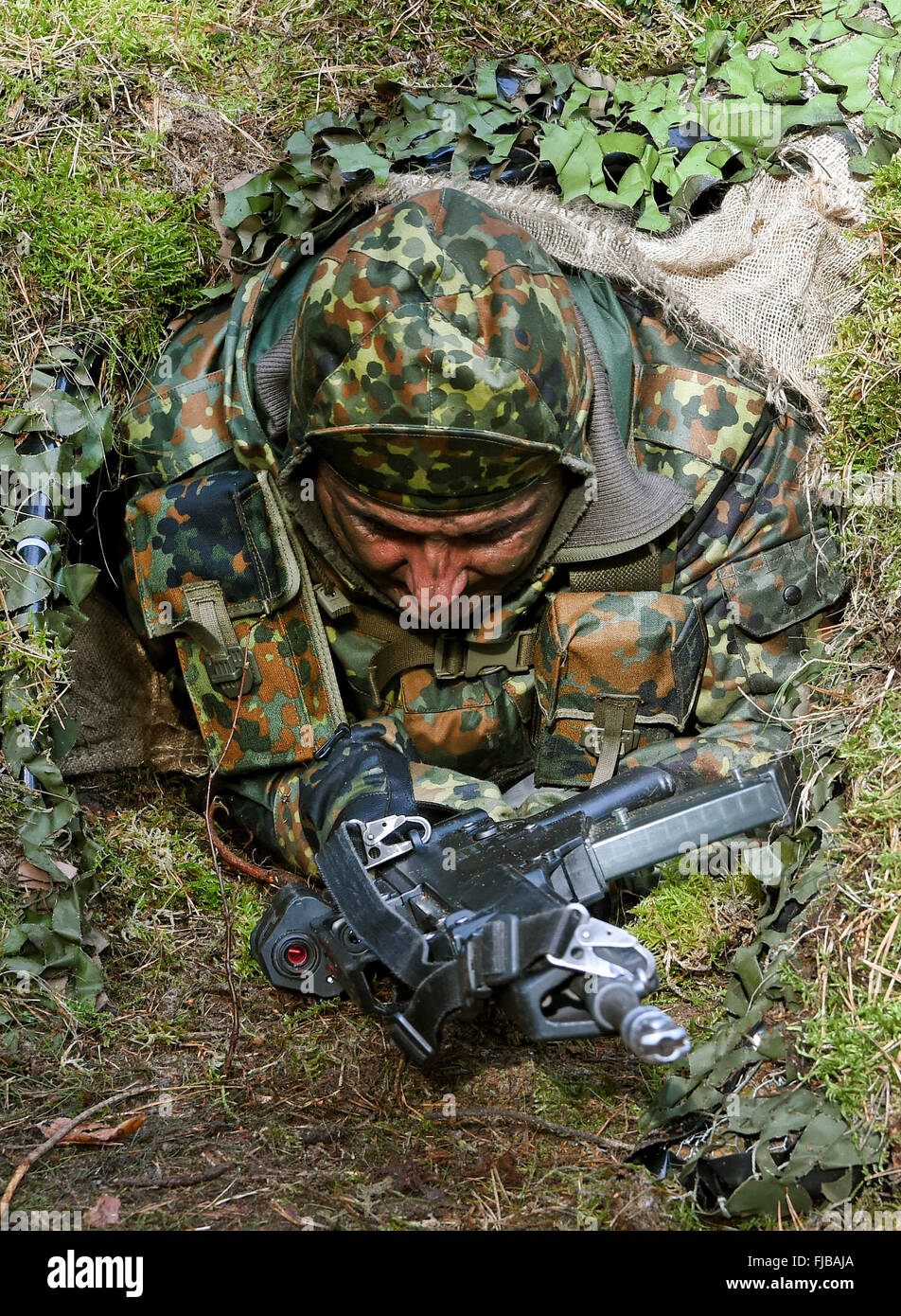 Munster, Germany. 01st Mar, 2016. A Kurdish officer emerging from a ...