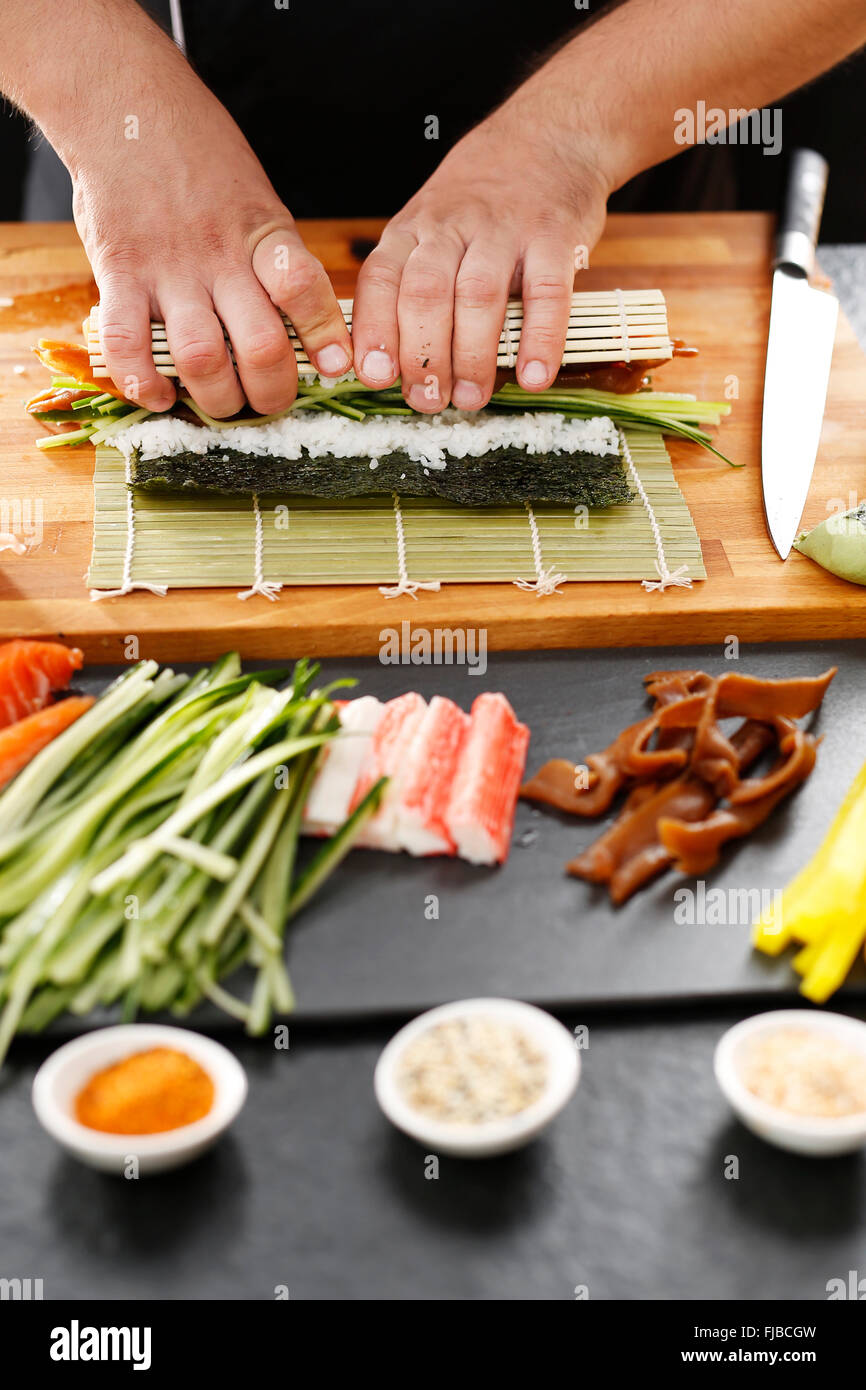 The steps for creating sushi. Folding sushi. Preparing sushi. Bamboo ...