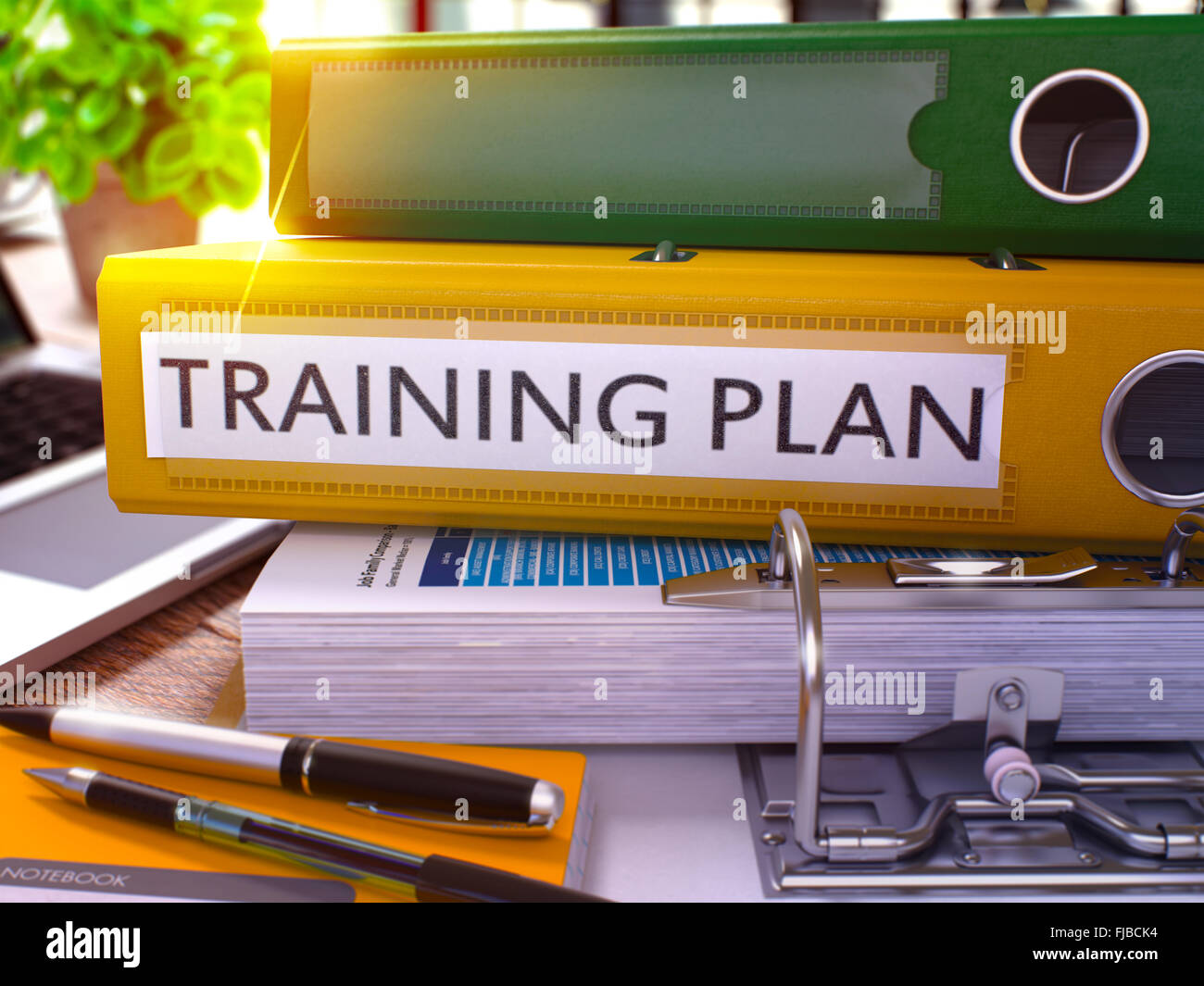 Yellow Office Folder with Inscription Training Plan Stock Photo - Alamy