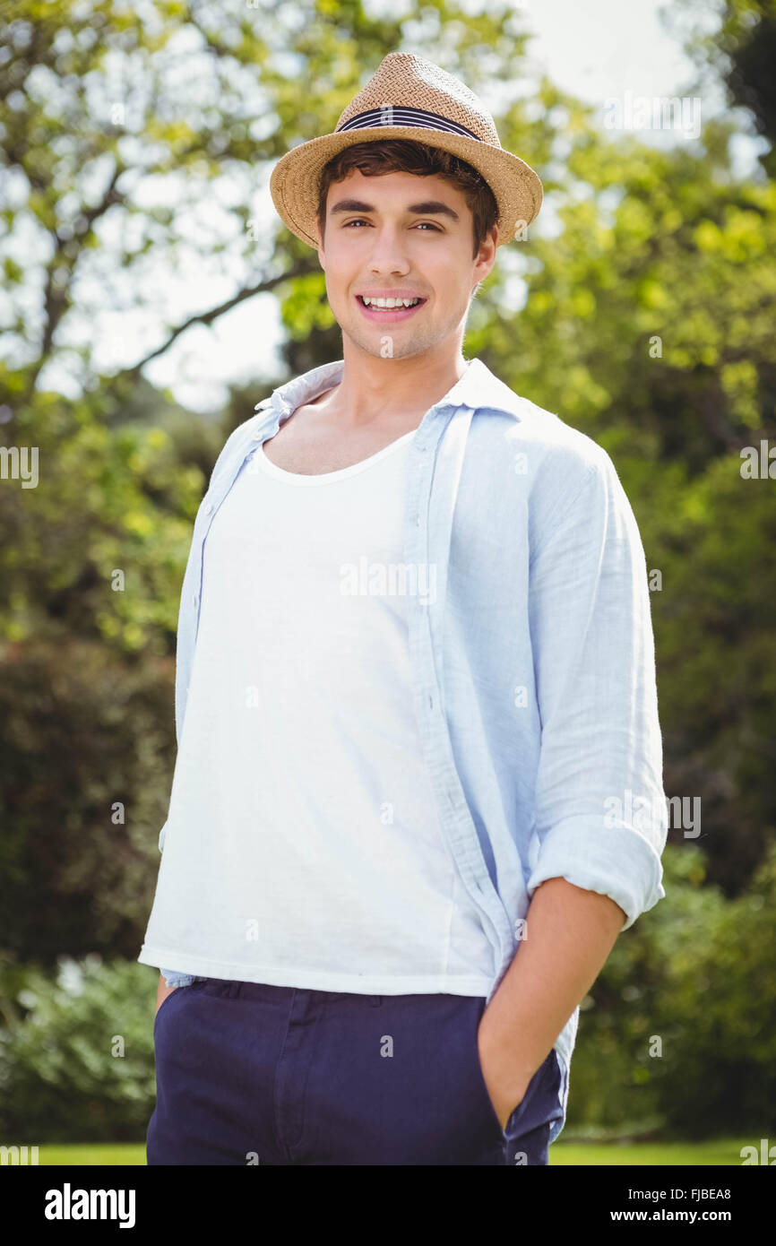 Young man standing in garden Stock Photo - Alamy