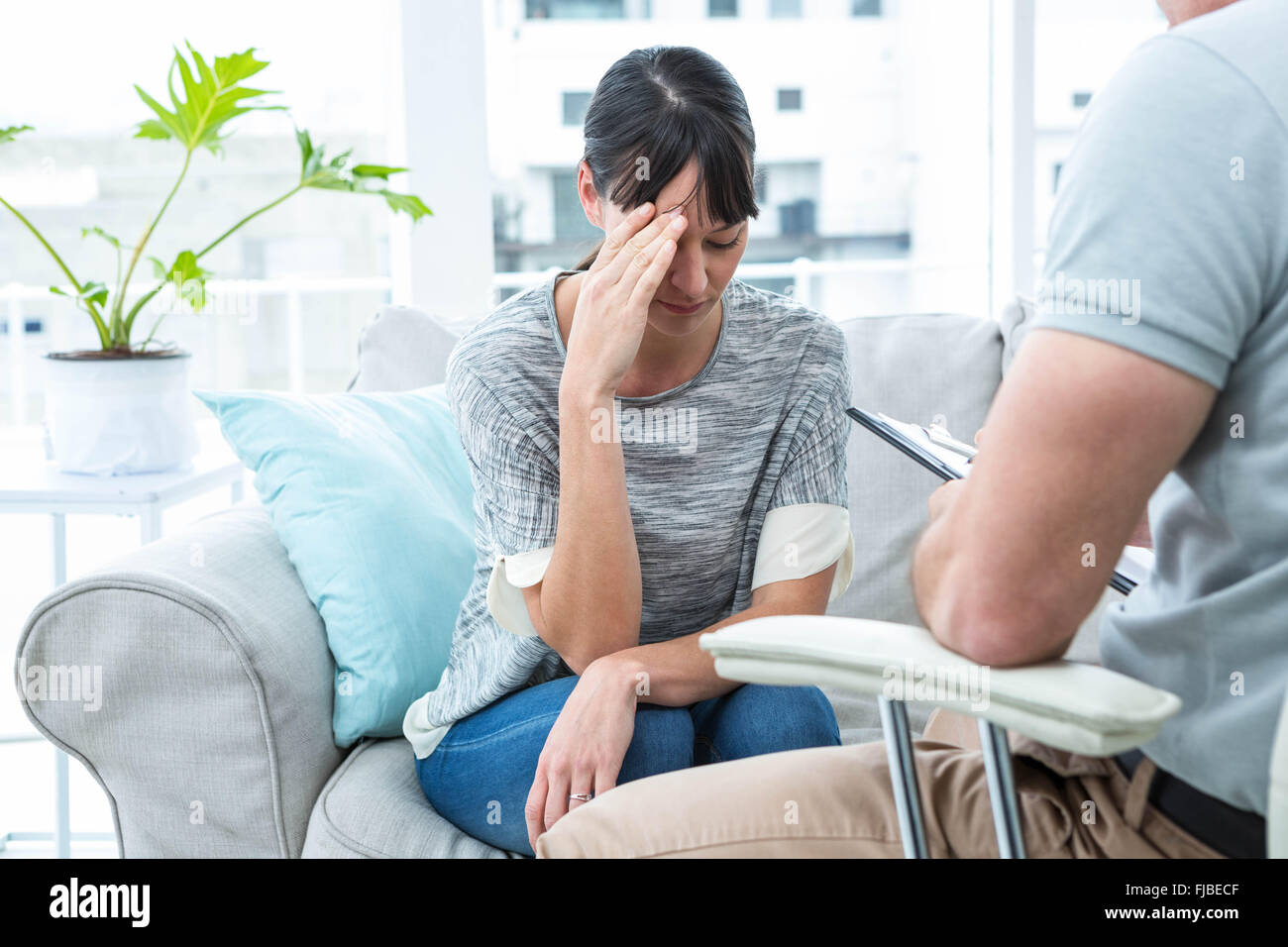 Therapist consoling a woman Stock Photo - Alamy