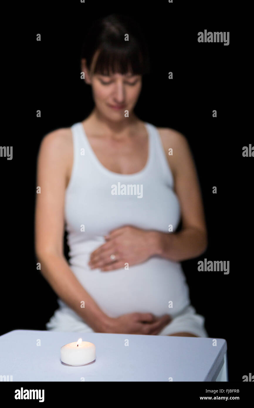 Pregnant woman and glass on table Stock Photo - Alamy