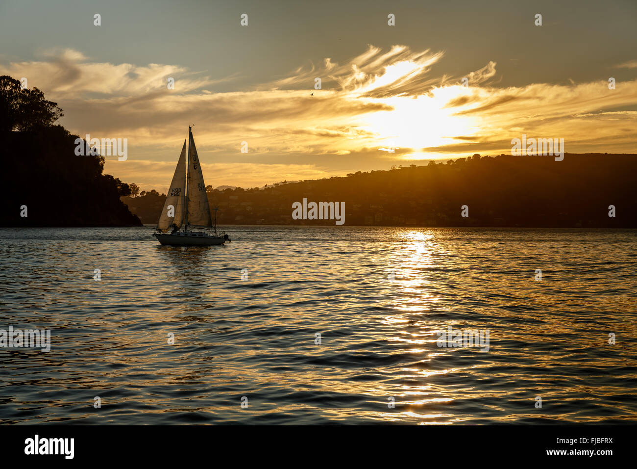 Sailboat at sunset hi-res stock photography and images - Alamy