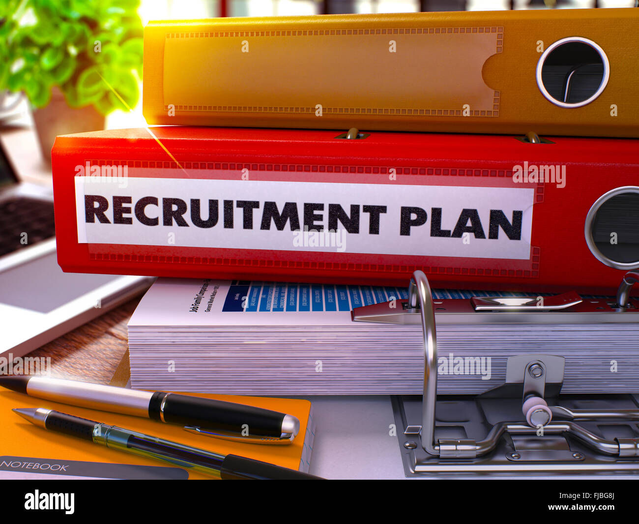 Red Ring Binder with Inscription Recruitment Plan Stock Photo - Alamy