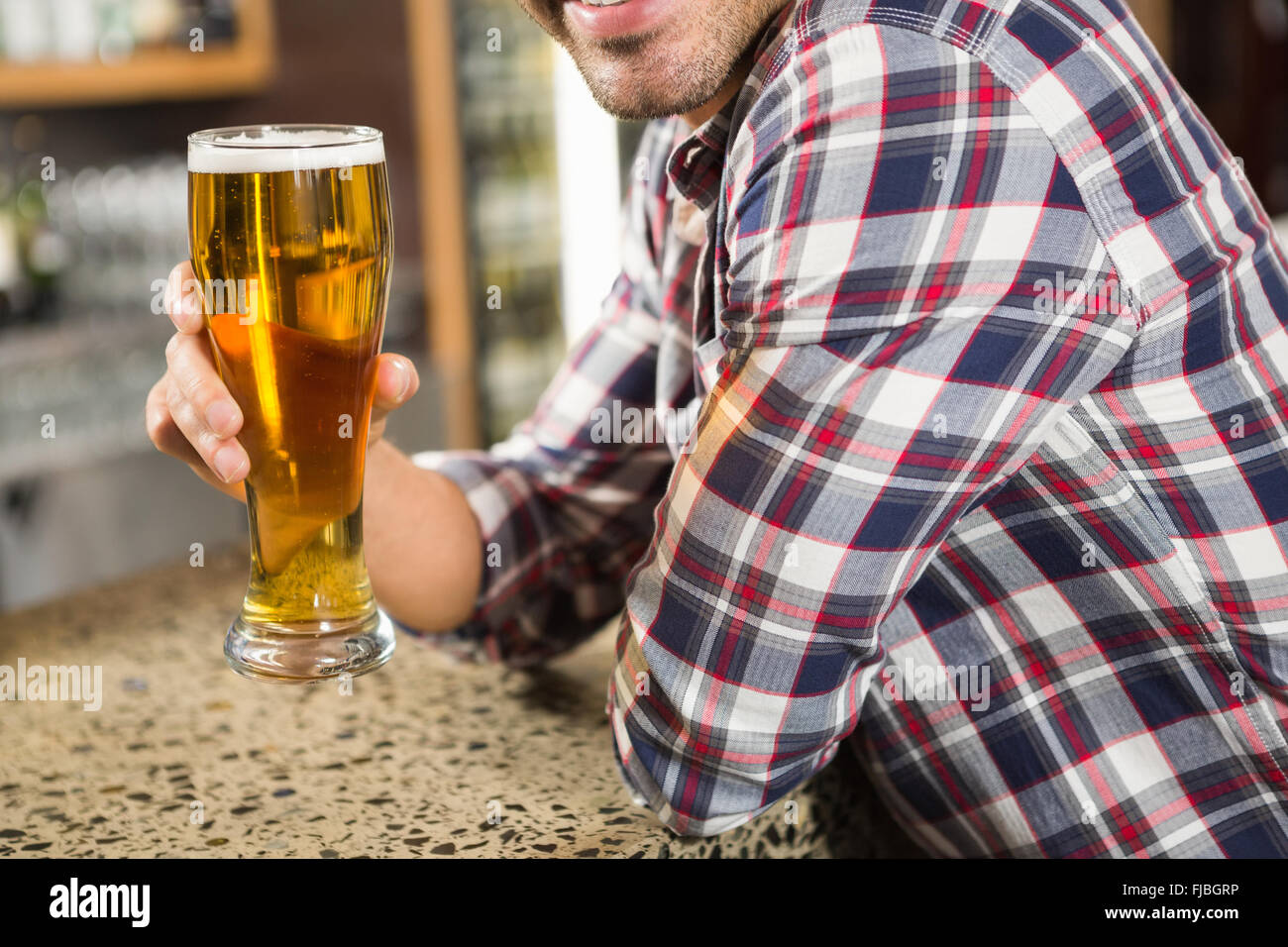 Handsome man having a beer Stock Photo - Alamy