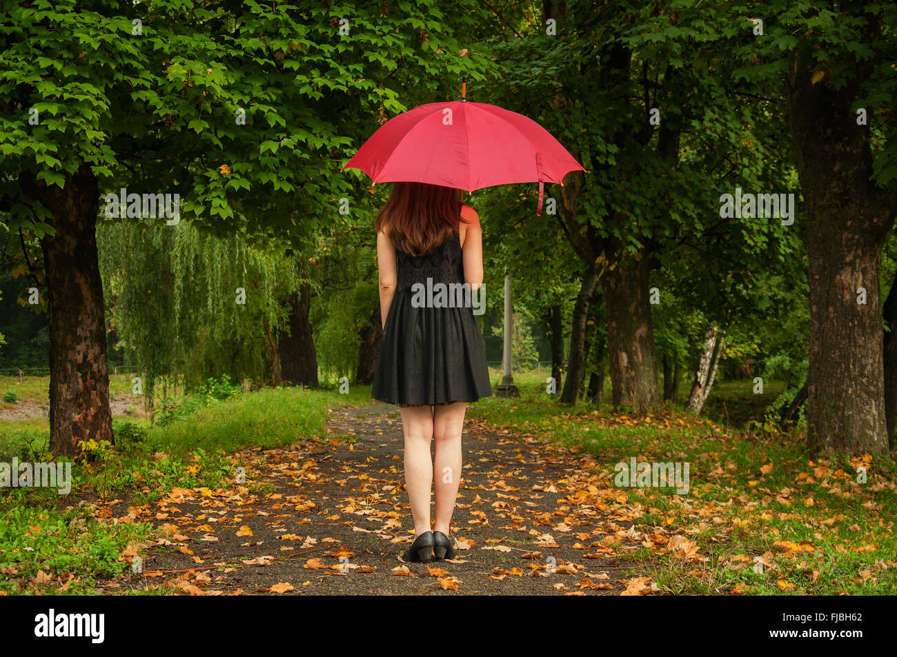 Posing with umbrella hi-res stock photography and images - Alamy