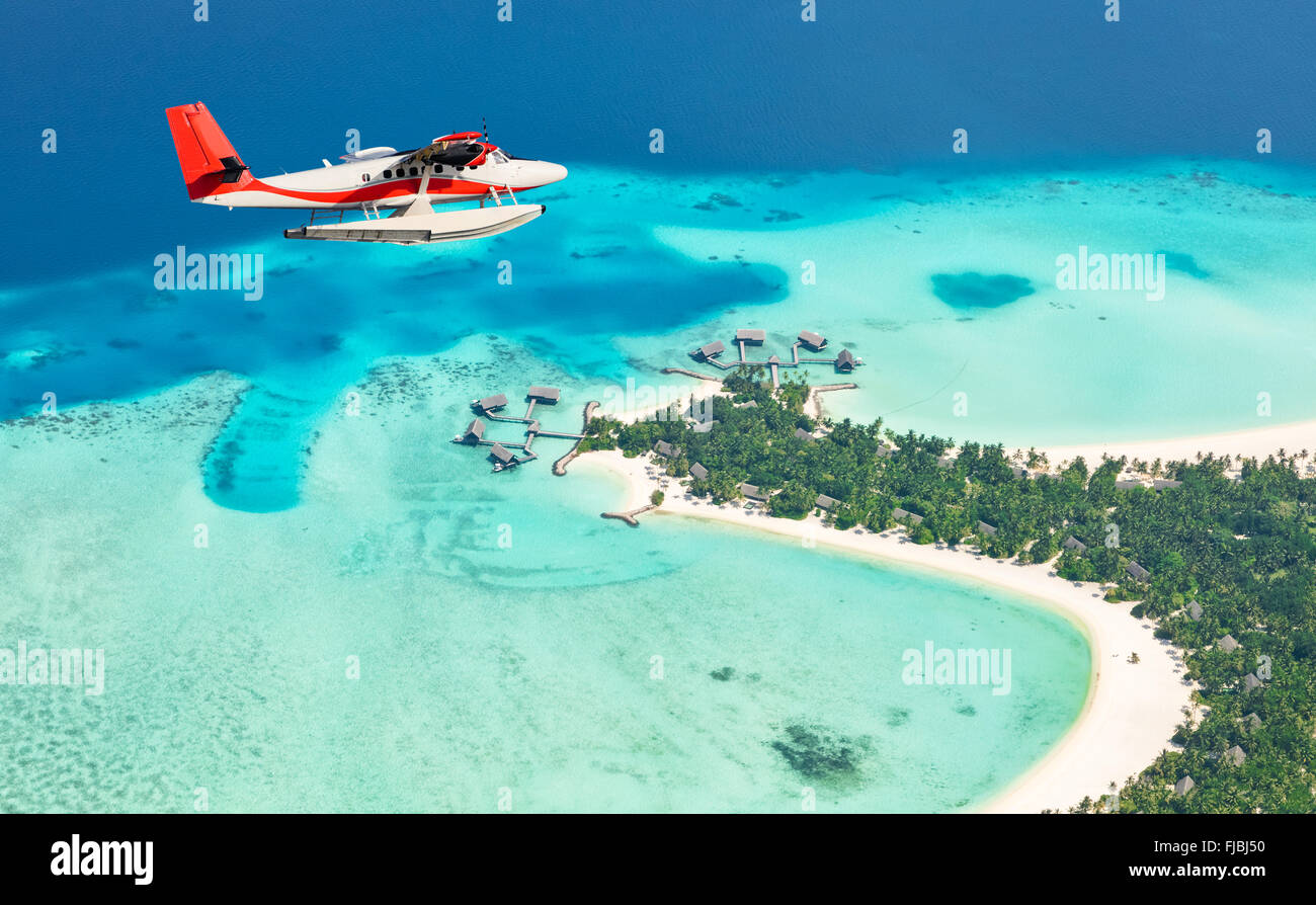 Maldives seaplane flying above islands Stock Photo - Alamy
