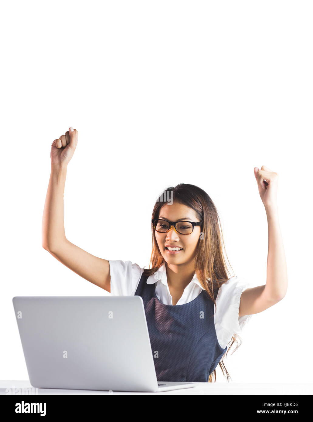 Happy businesswoman using laptop and raising arms Stock Photo - Alamy
