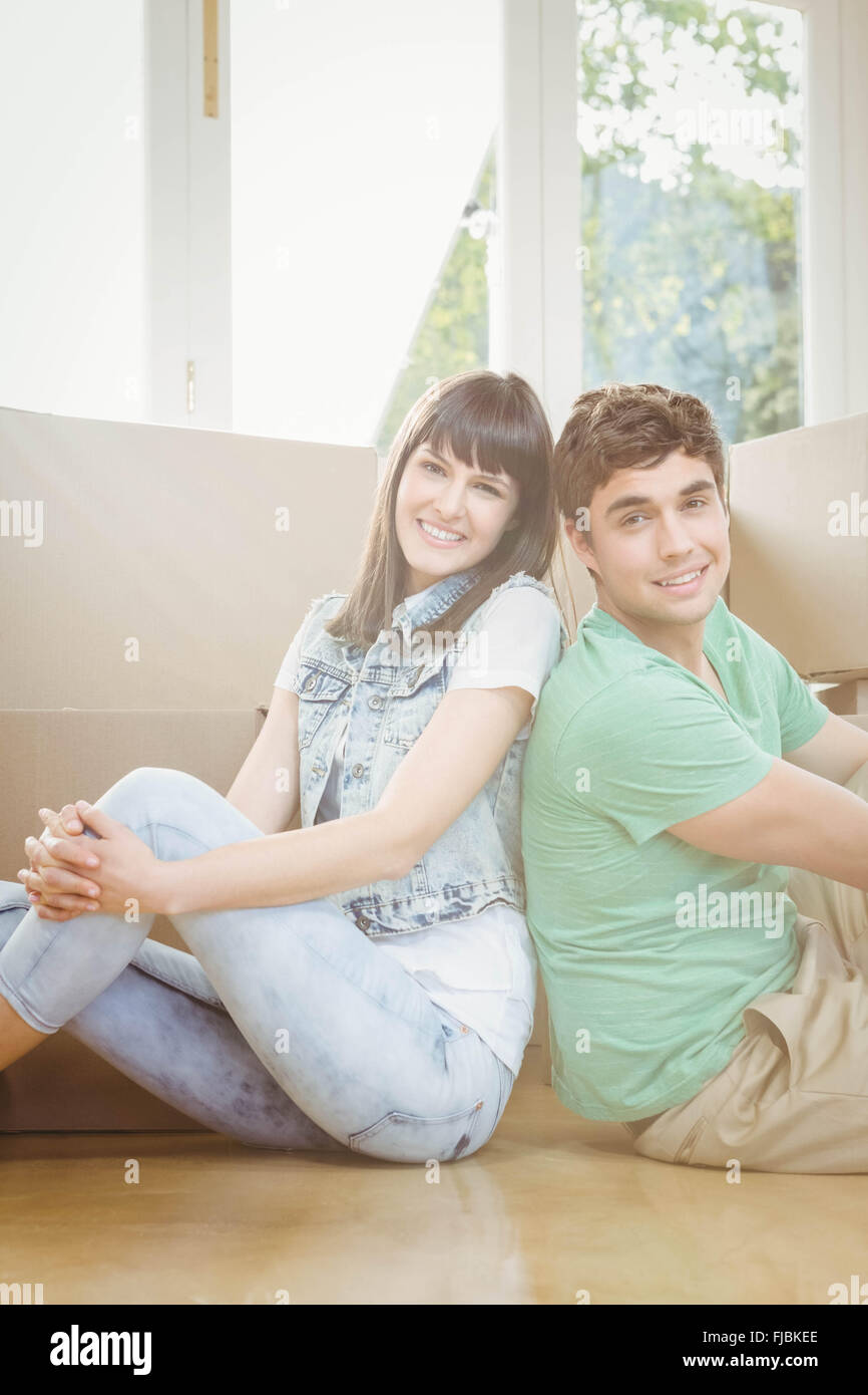 Young smiling couple sitting in hi-res stock photography and images - Alamy